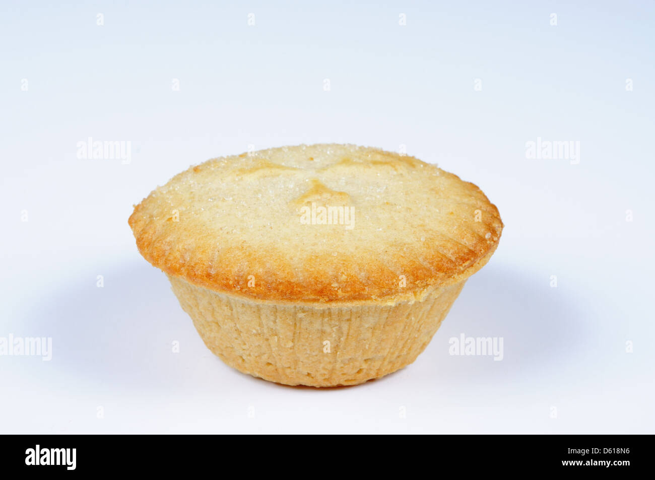 Single mince pie against a grey background Stock Photo - Alamy