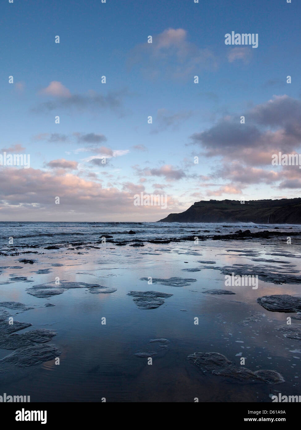 Sunset clouds on beach, Boggle hole, Yorkshire Stock Photo - Alamy