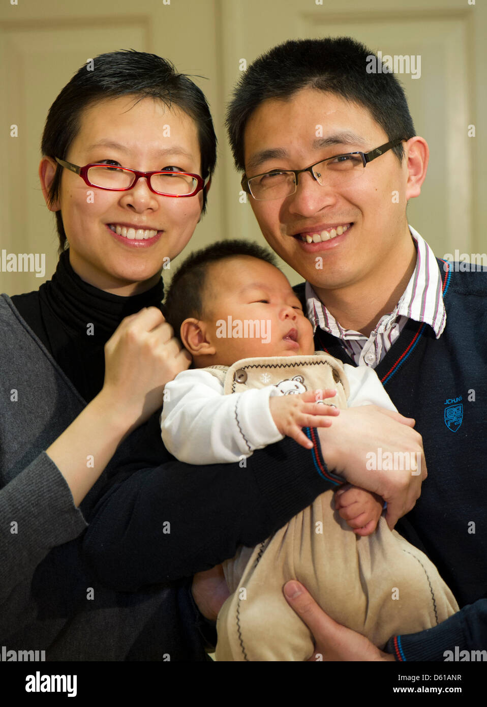 Baby boy Frei, his mother Huixian Yang and his father Hong Shen pose ...