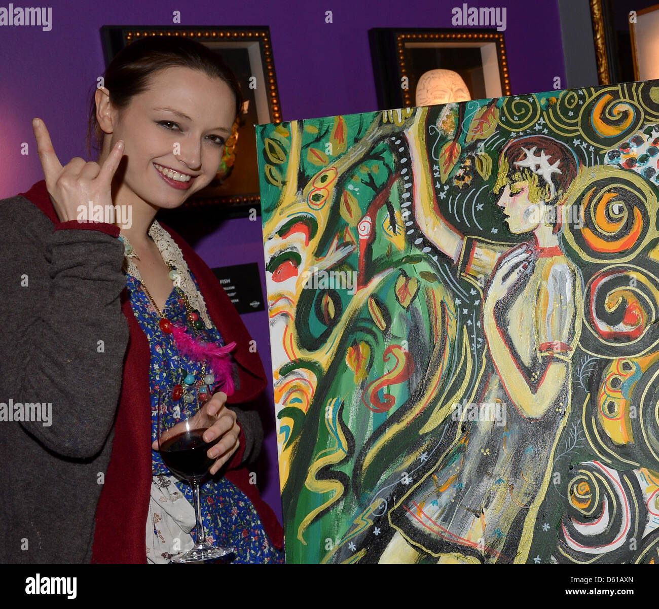 Artist and musician MiMi Westernhagen poses next to her painting at the ...