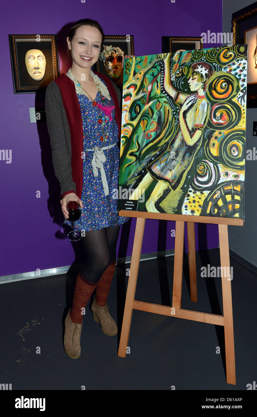 Artist and musician MiMi Westernhagen poses next to her painting at the ...
