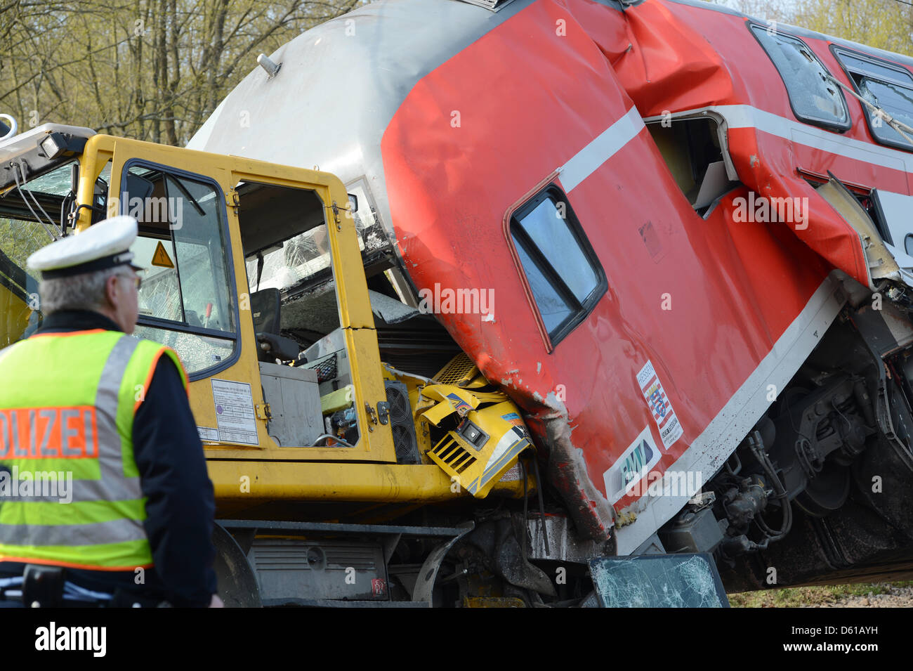 A firefighters and rescue teams stand at the site of a train accident ...