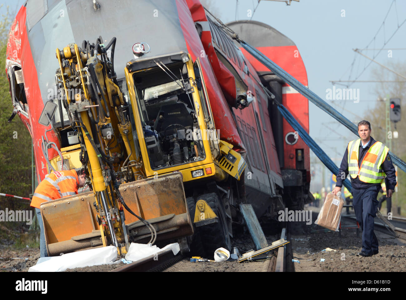 A firefighters and rescue teams stand at the site of a train accident ...
