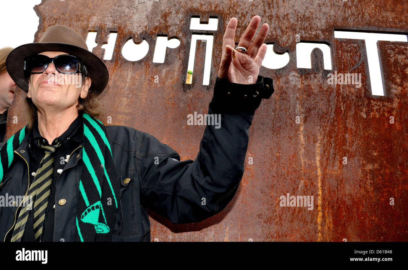Rock musician Udo Lindenberg stands next to his new monument on the ...