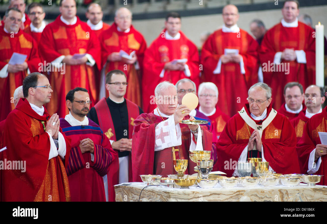 Papal delegate Cardinal Marc Ouellet (L) blessed the Holy Robe at the ...