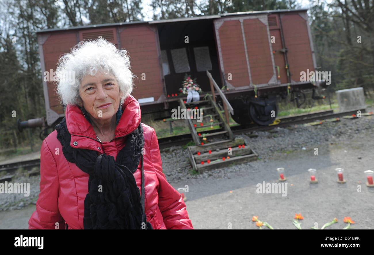 Witness Fanny Heymann poses in front of a railway wagon at the memorial ...