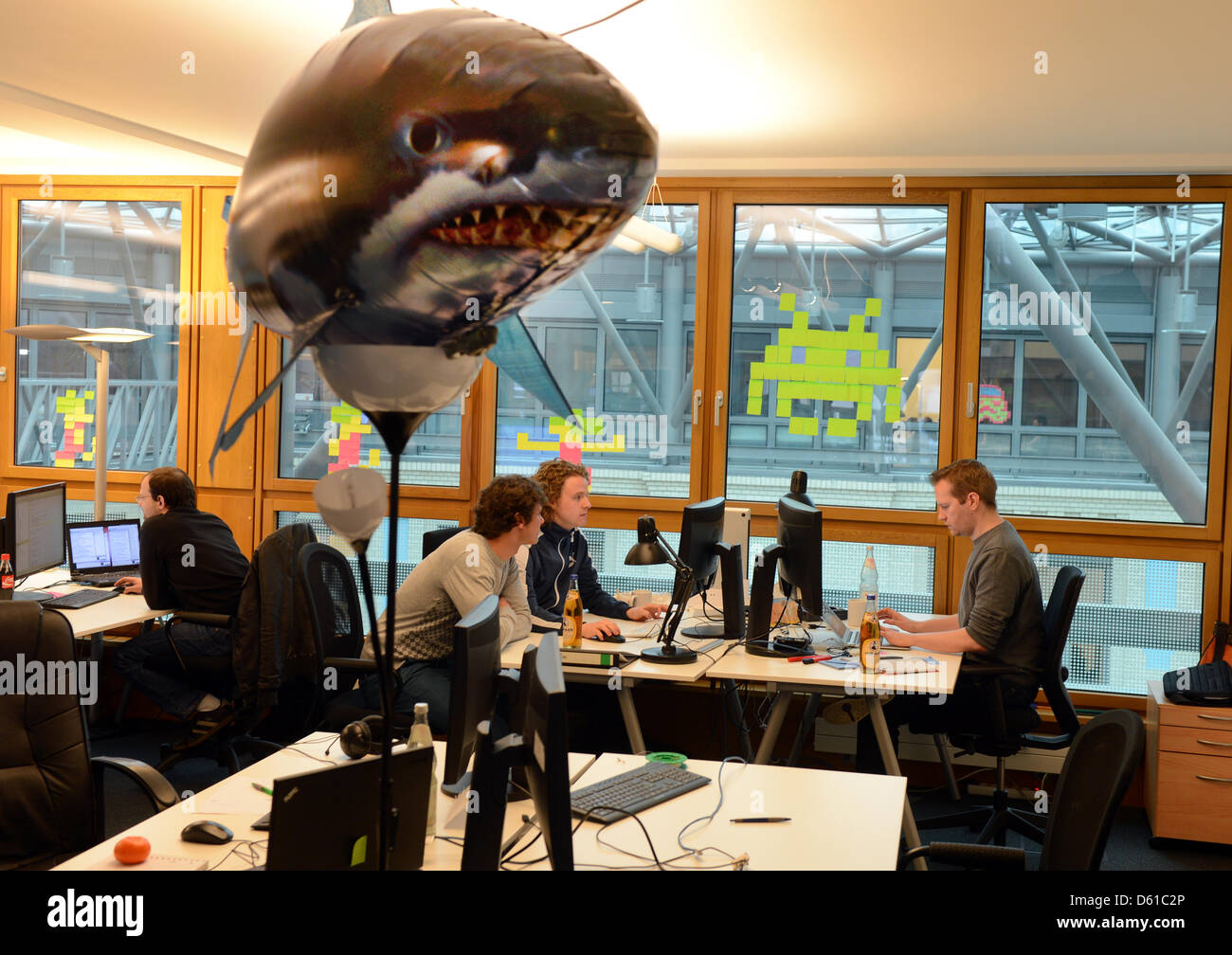 Staff members work at the headquarters of the Rocket Internet company ...