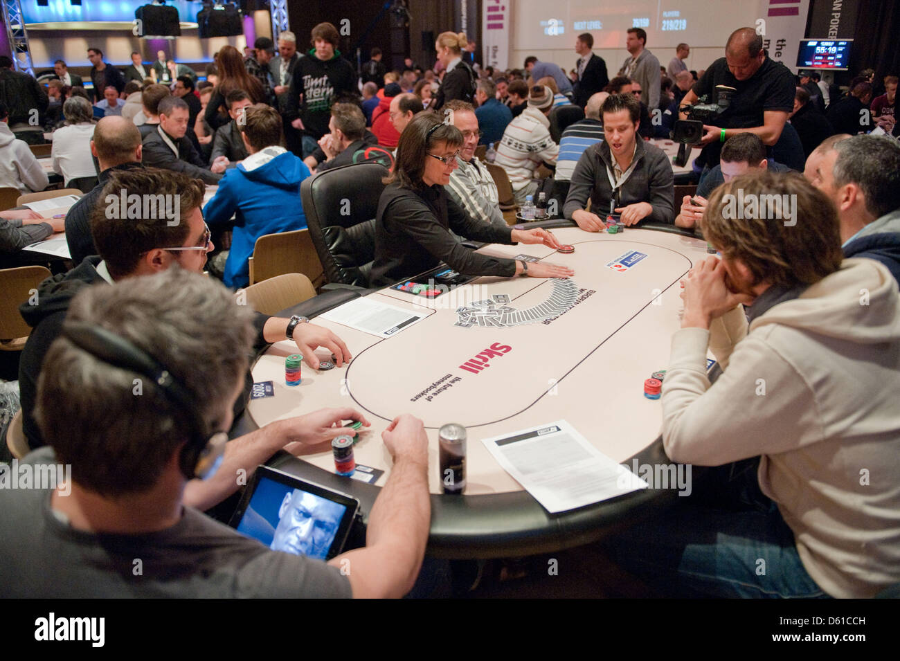 Players and croupier sit at the gambling tables during the European ...