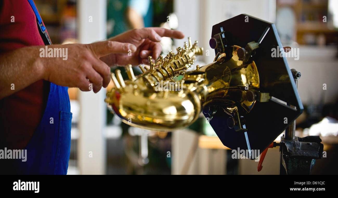 Master instrument maker Norbert Walsch repairs a tuba in Radebeul ...