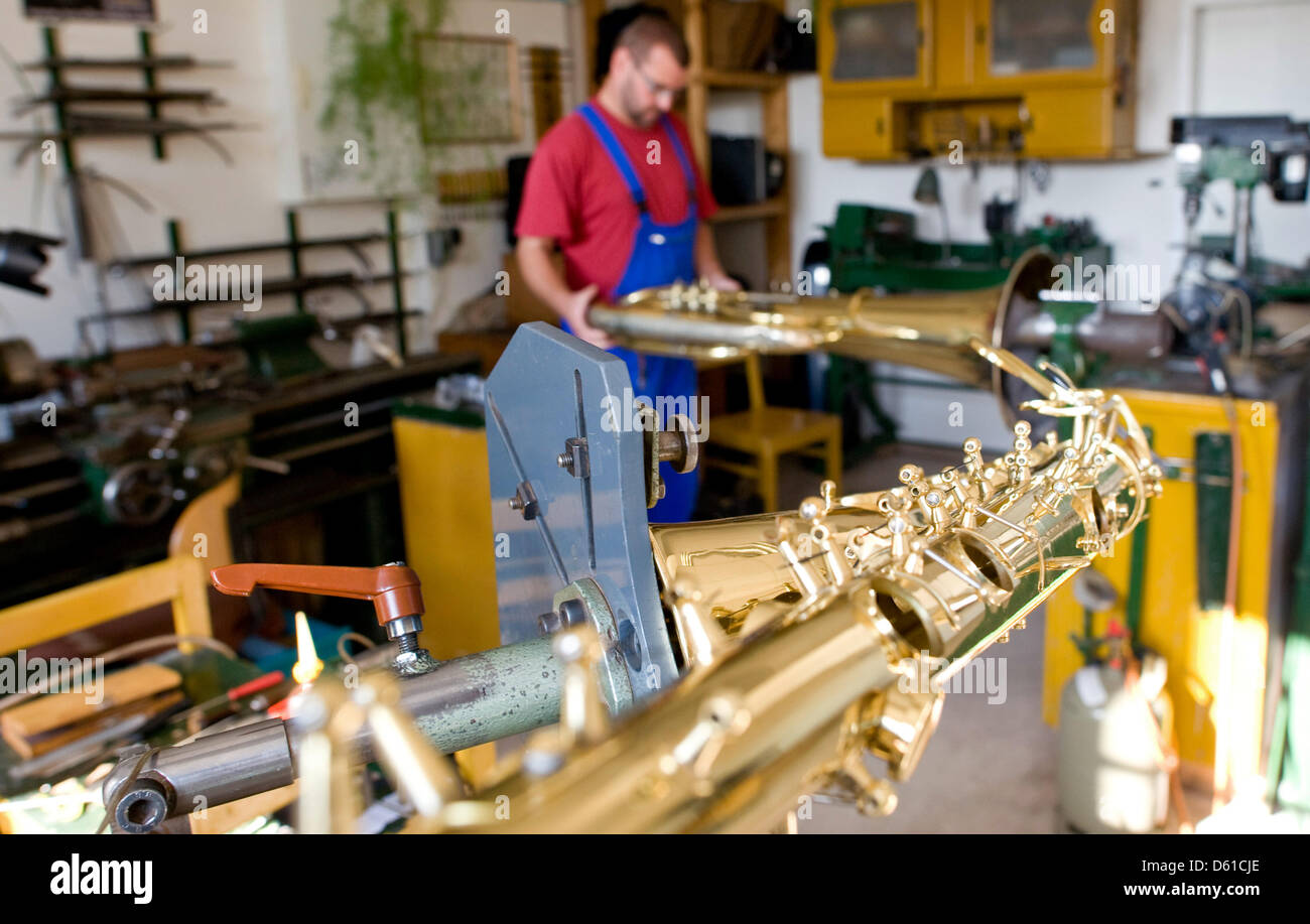 Master instrument maker Norbert Walsch repairs a tuba in Radebeul ...