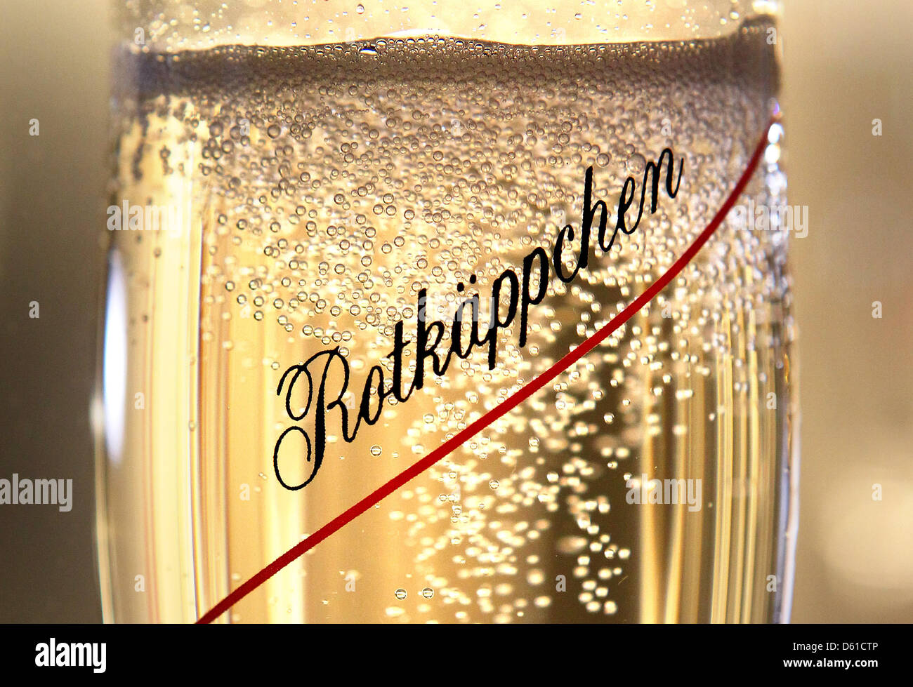A glass of sparkling wine stands on a table during the financial ...