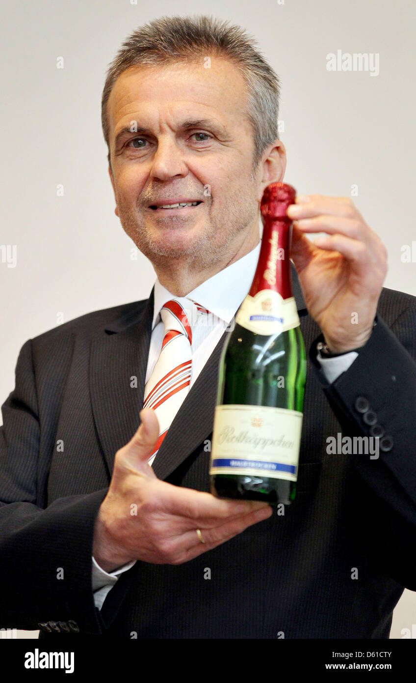 Rotkaeppchen-Mumm director Gunter Heise holds a Rotkaeppchen bottle of ...