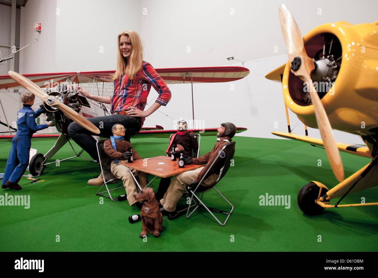 Model Michele stands at a model of a double decker at Intermodellbau in ...