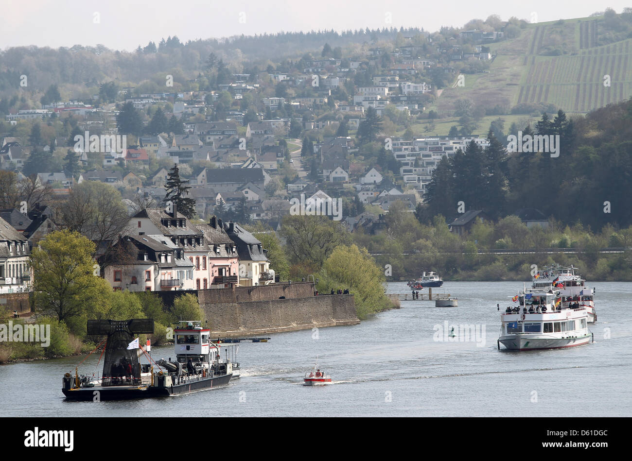 A boat carries an oversized replica of the Holy Robe during the Holy ...