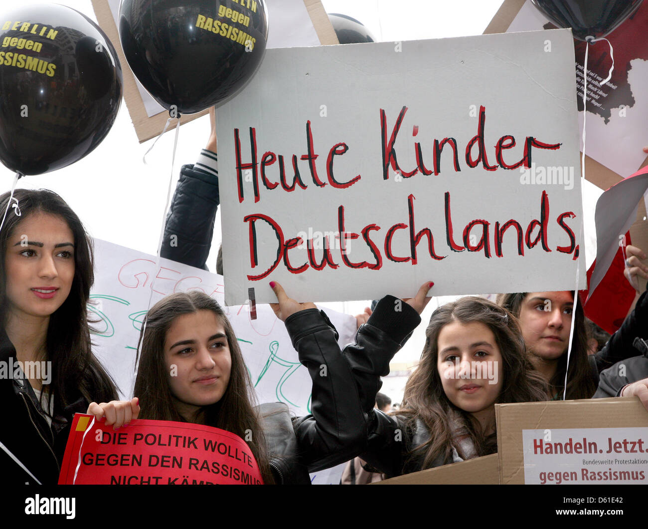 Children of Germany today is written on a sign held by a pupil during a ...