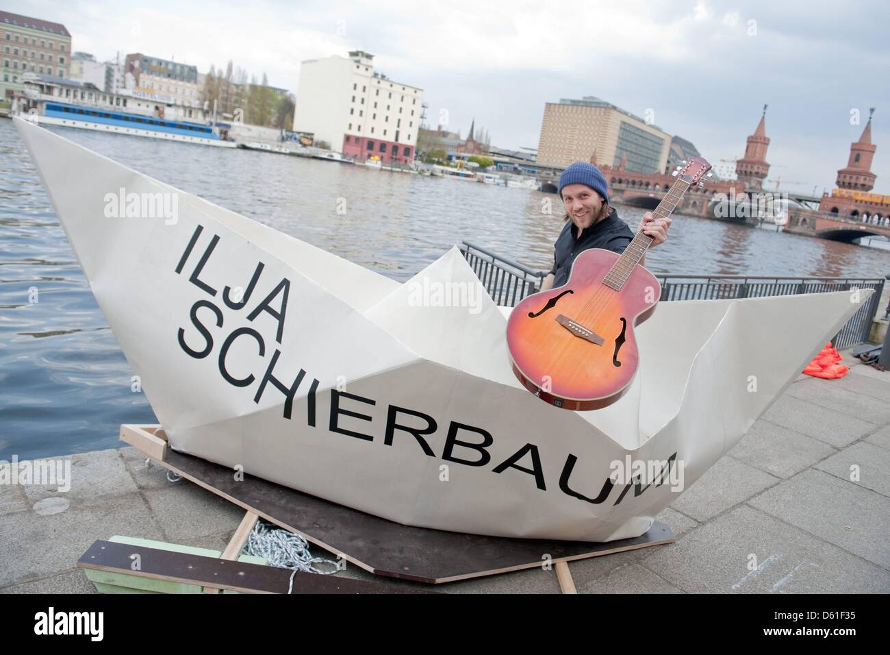 Singer-songwriter Ilja Schierbaum is pictured on a giant paper boat ...