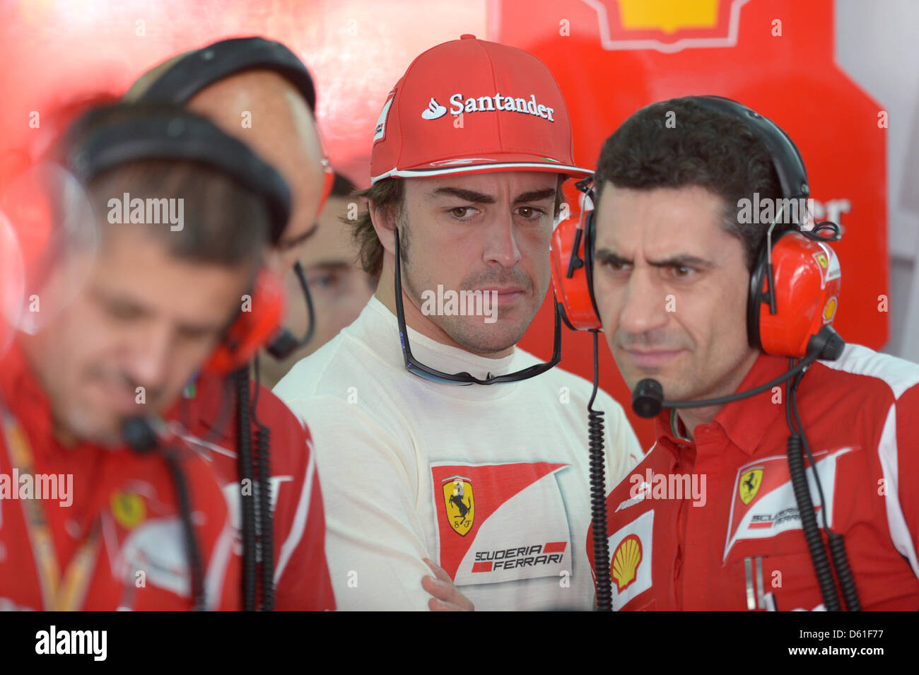Spanish Formula One driver Fernando Alonso of Ferrari (C) and his race ...