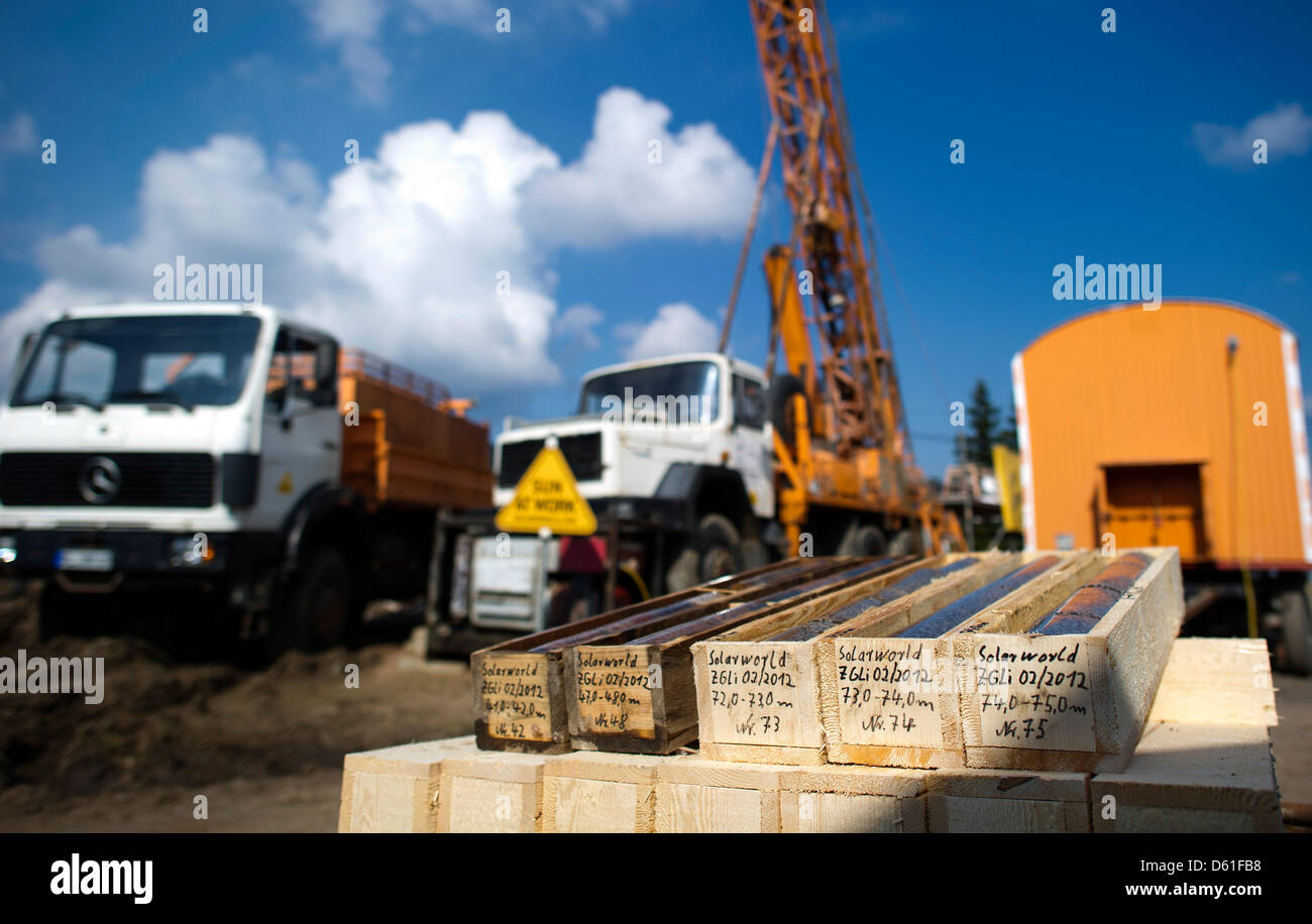 Core samples and a drilling rig are pictured for surveying lithium for ...