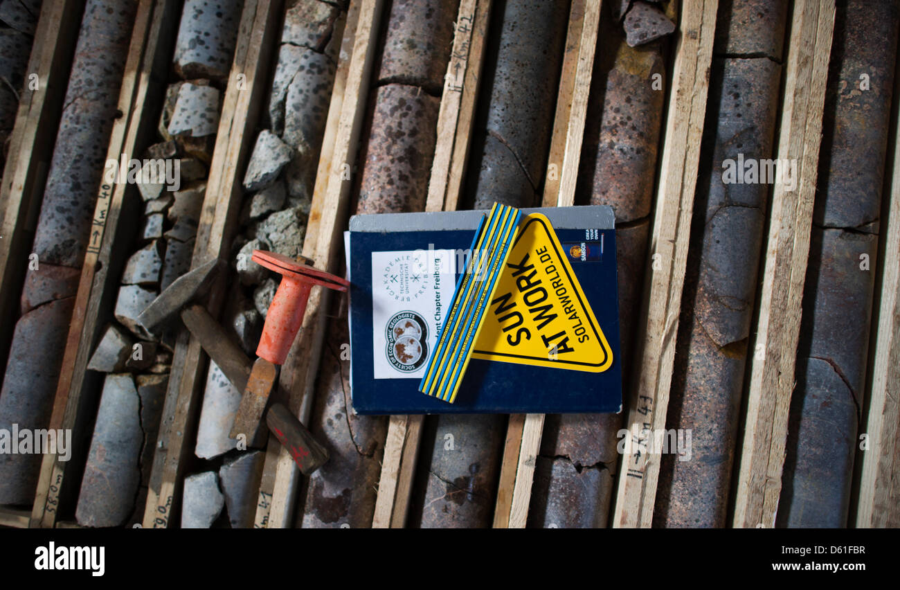 Core samples are stored near a drilling rig during a survey for lithium ...