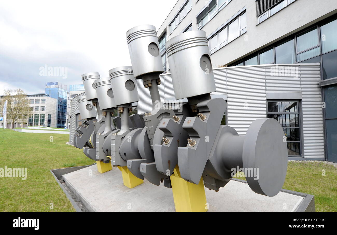 A sculpture of the pistons of a petrol engine stands in front of the ...