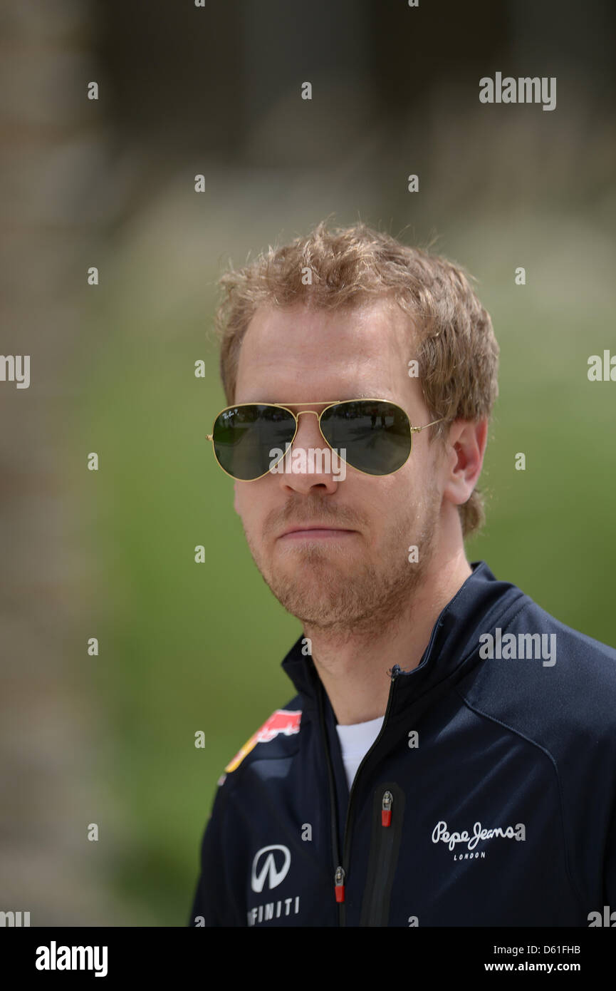 German Formula One driver Sebastian Vettel of Red Bull walks through ...