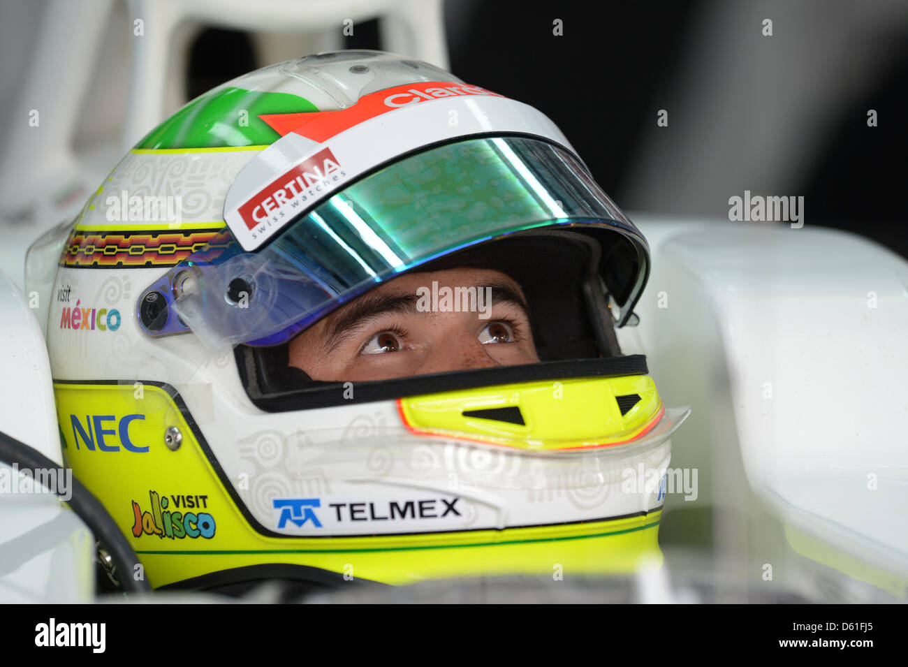 Mexican Formula One driver Sergio Perez of Sauber sits in his car in ...