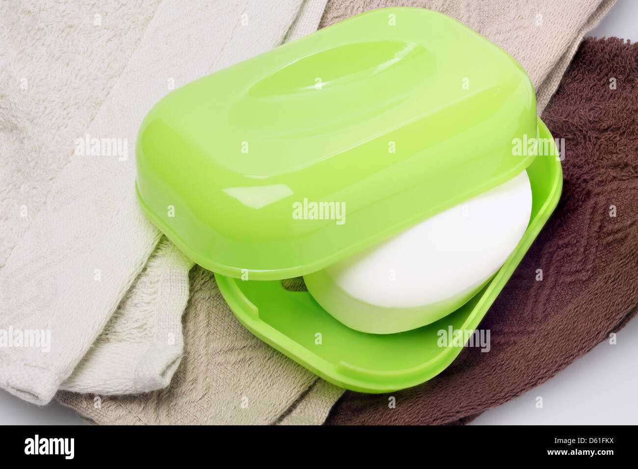 Soap In Container Sitting On Face Towels Stock Photo - Alamy