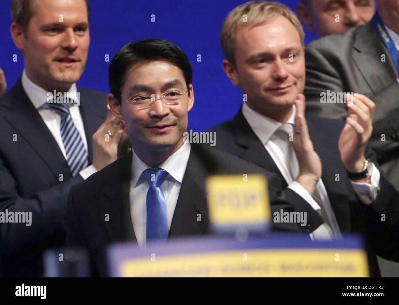 Federal Chairman of the FDP Rhilipp Roesler (C) stands between German ...