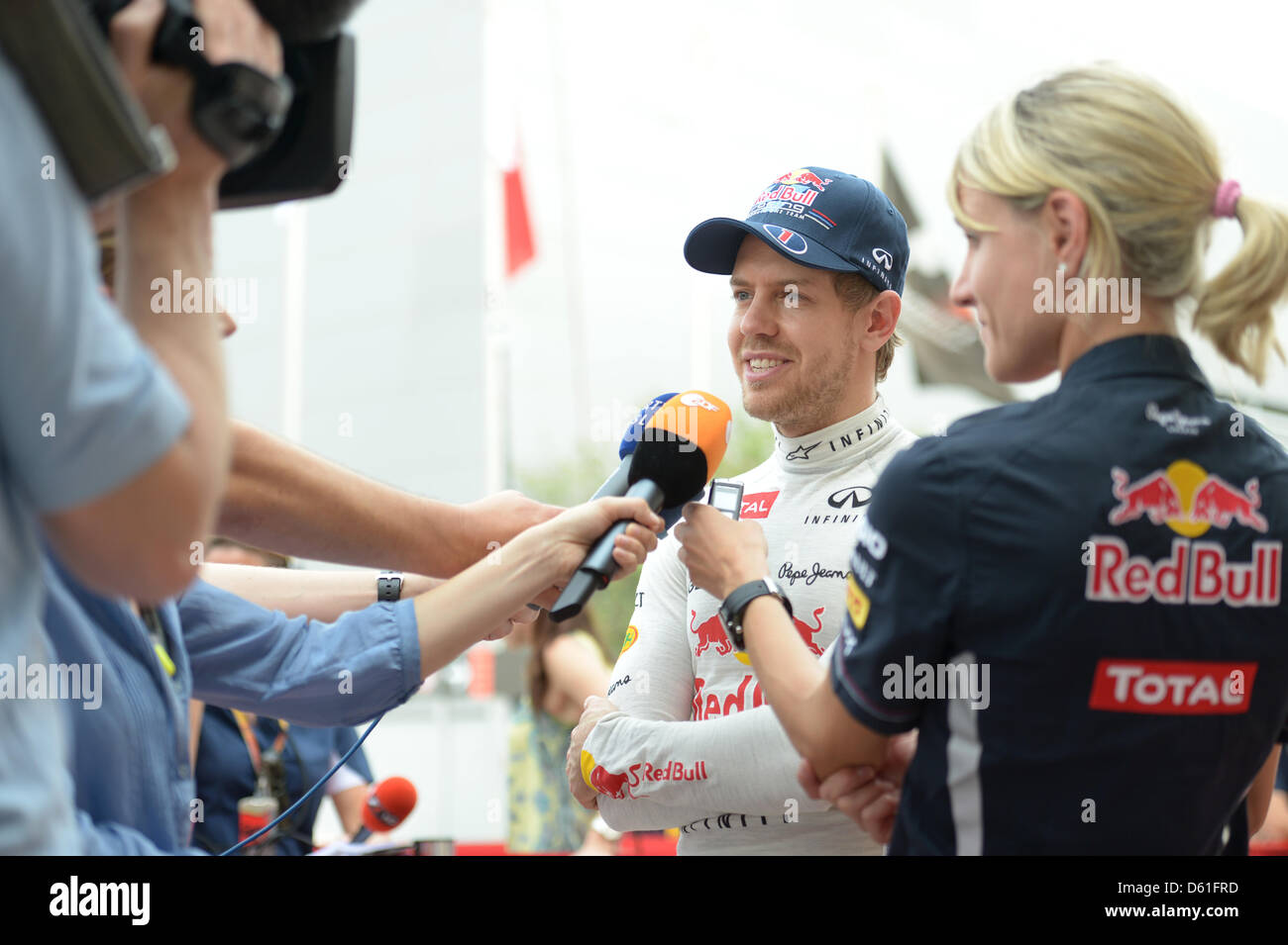 German Formula One driver Sebastian Vettel of Red Bull talks next to ...