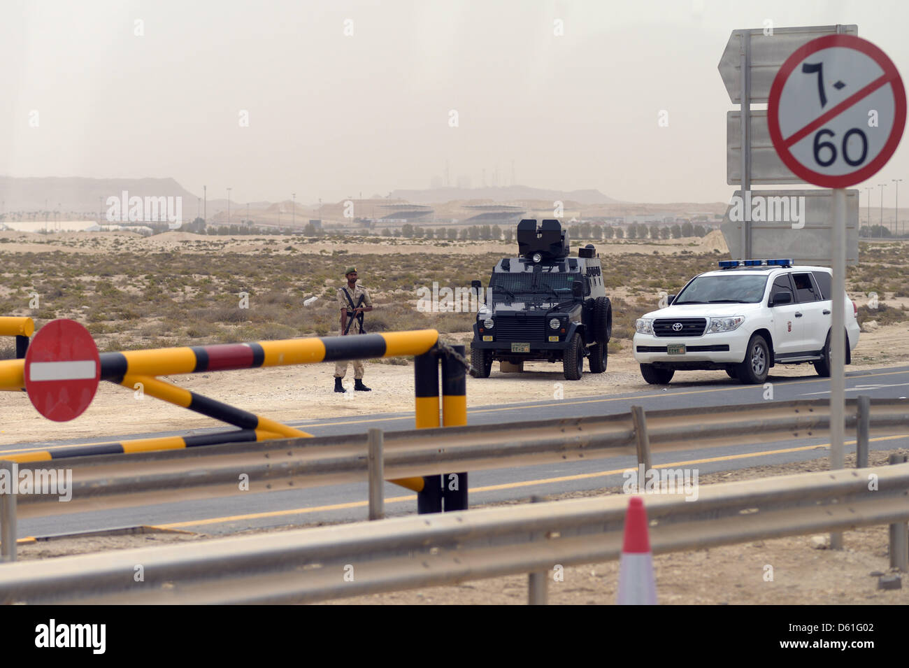 An armed Soldier next to a bullet-proof vehicle on the road to the ...