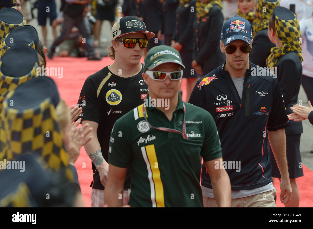 Finnish Formula One driver Kimi Raikkonen (L - R) of Lotus, Finnish ...