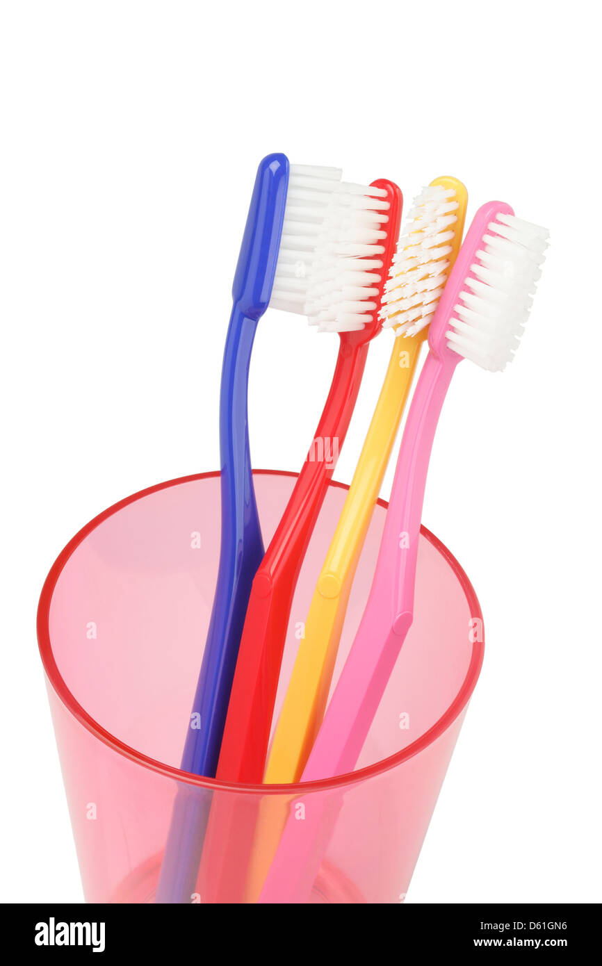 Colorful Toothbrushes In Plastic Container On White Background Stock ...