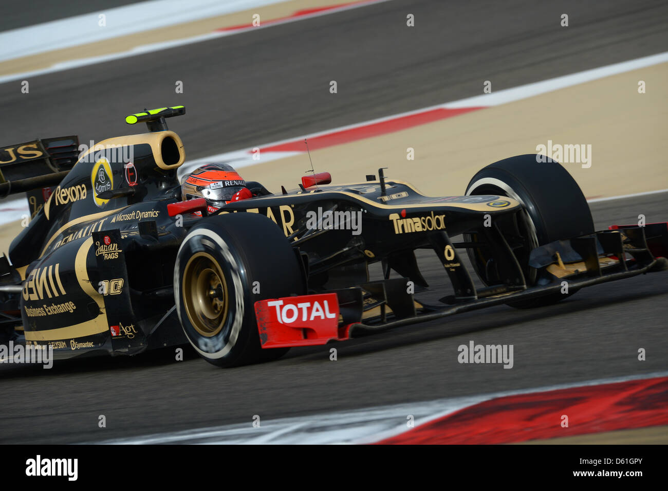 French Formula One driver Romain Grosjean of Lotus steers his car ...