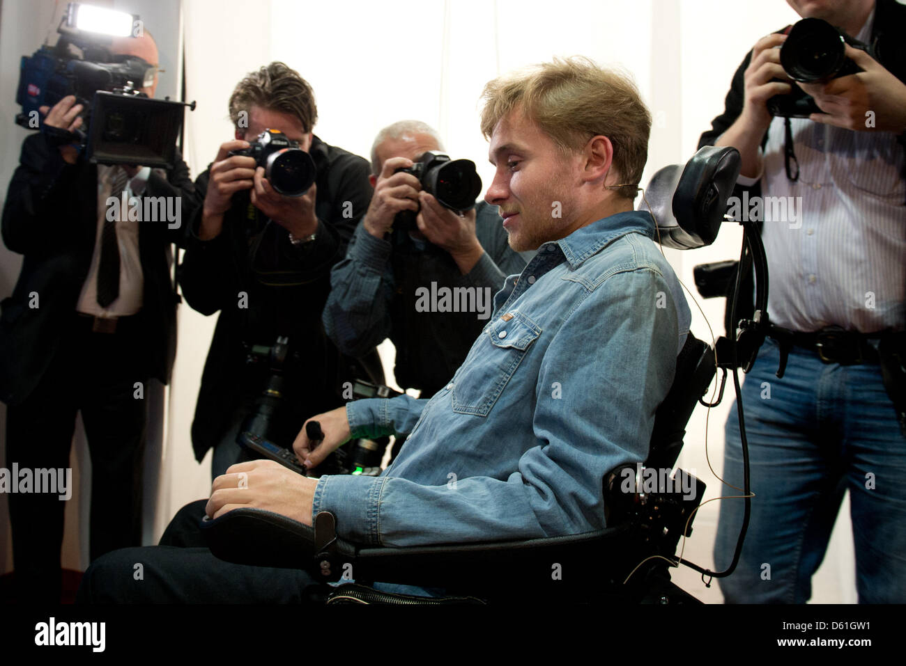 Author Samuel Koch (C) arrives for the presentation of his book 'Samuel ...