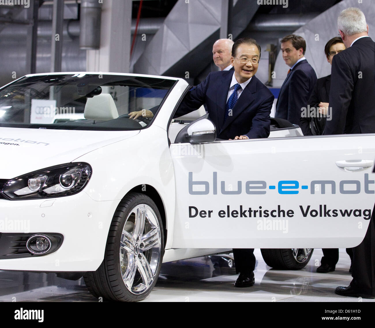Chinese Prime Minister Wen Jiabao gets into a Volkswagen E-Golf at the ...