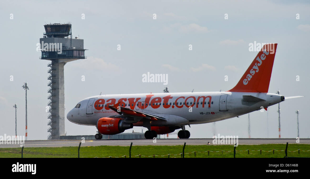 An EasyJet plane lands in view of the new tower at Berlin-Schoenefeld ...