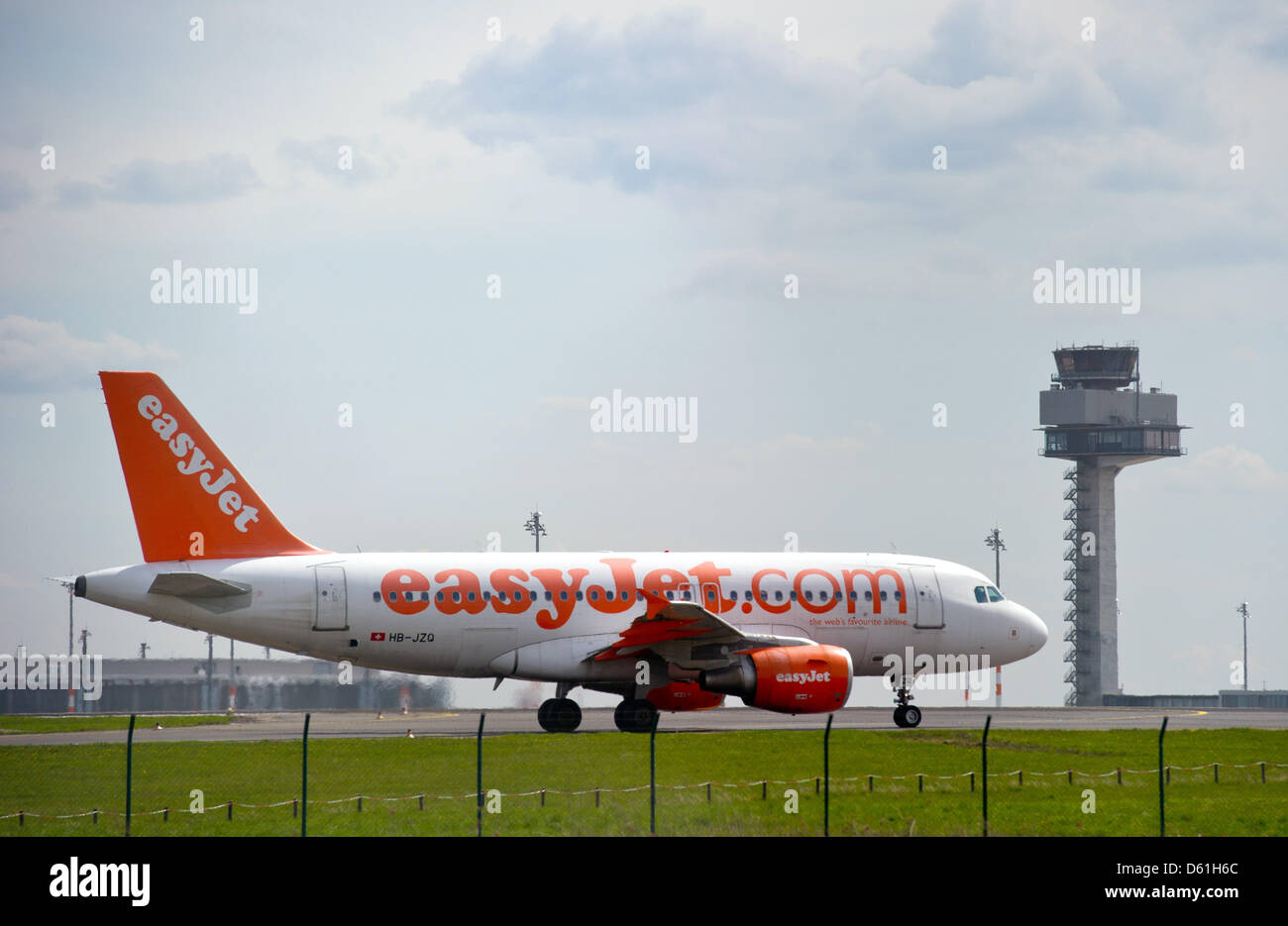 An EasyJet plane lands in view of the new tower at Berlin-Schoenefeld ...