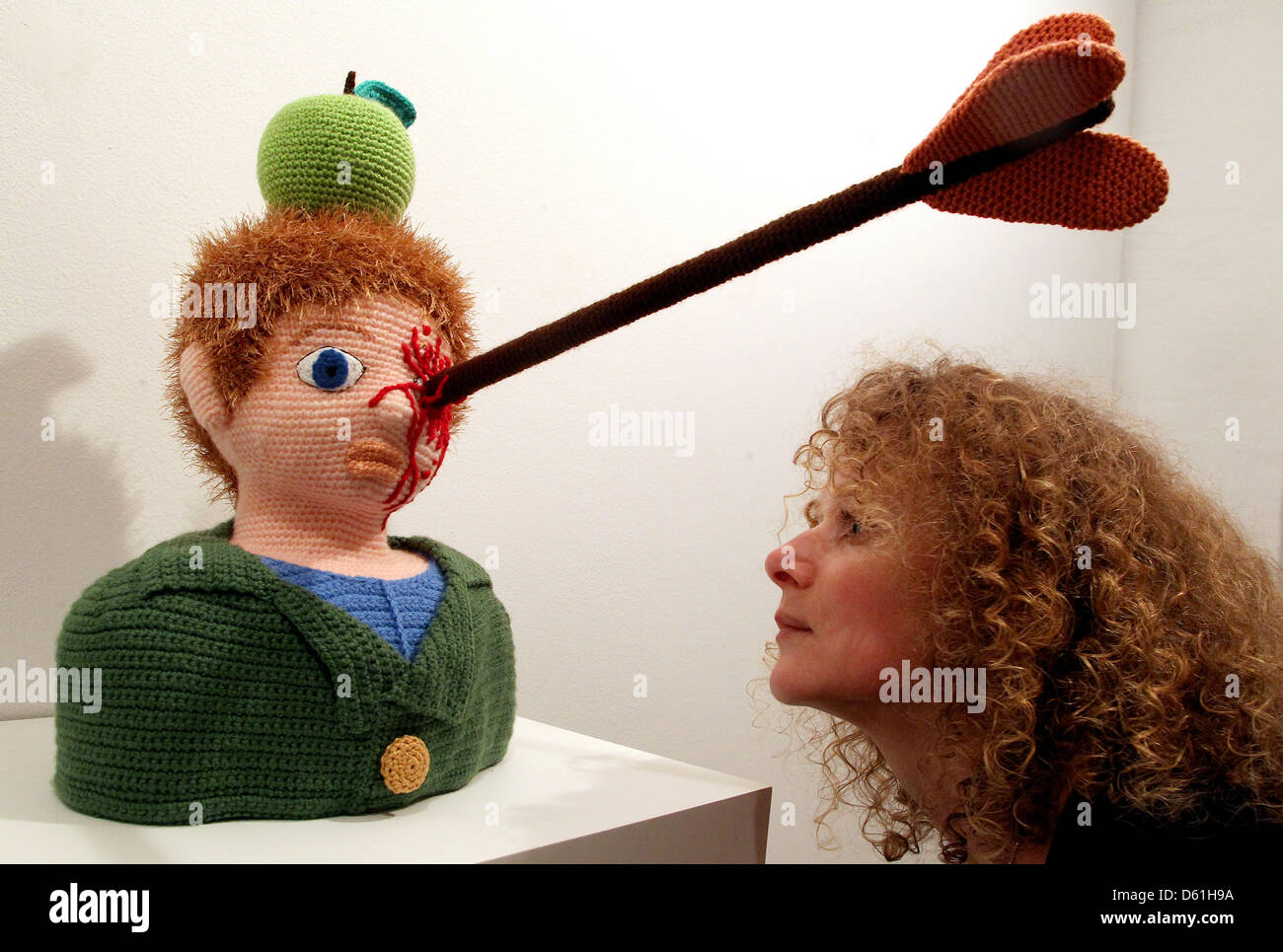 Gallery director Simone Wiechers looks at a William Tell figure with an ...