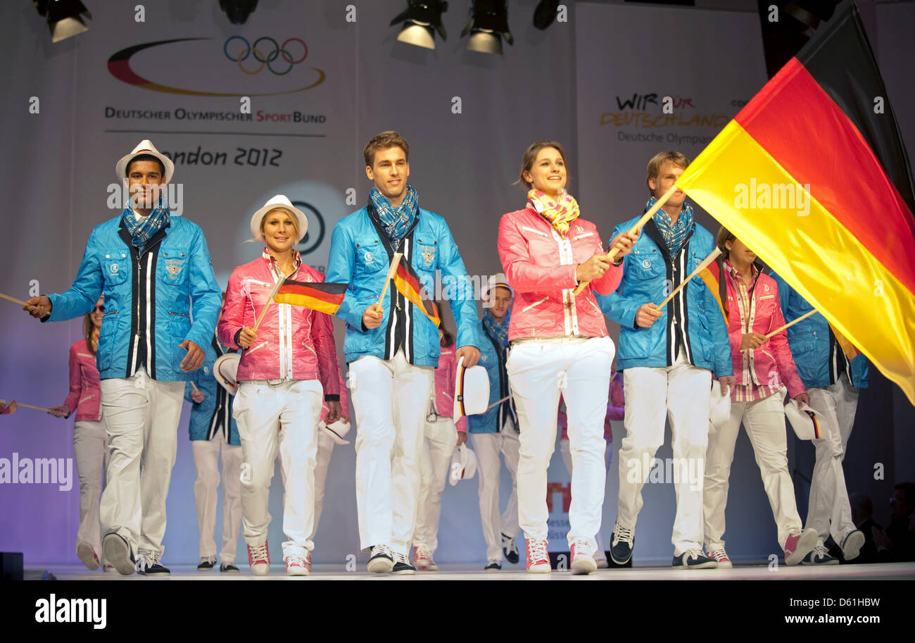 Swimmer Benjamin Starke (C-L) and fencer Britta Heidemann (C-R) walk ...