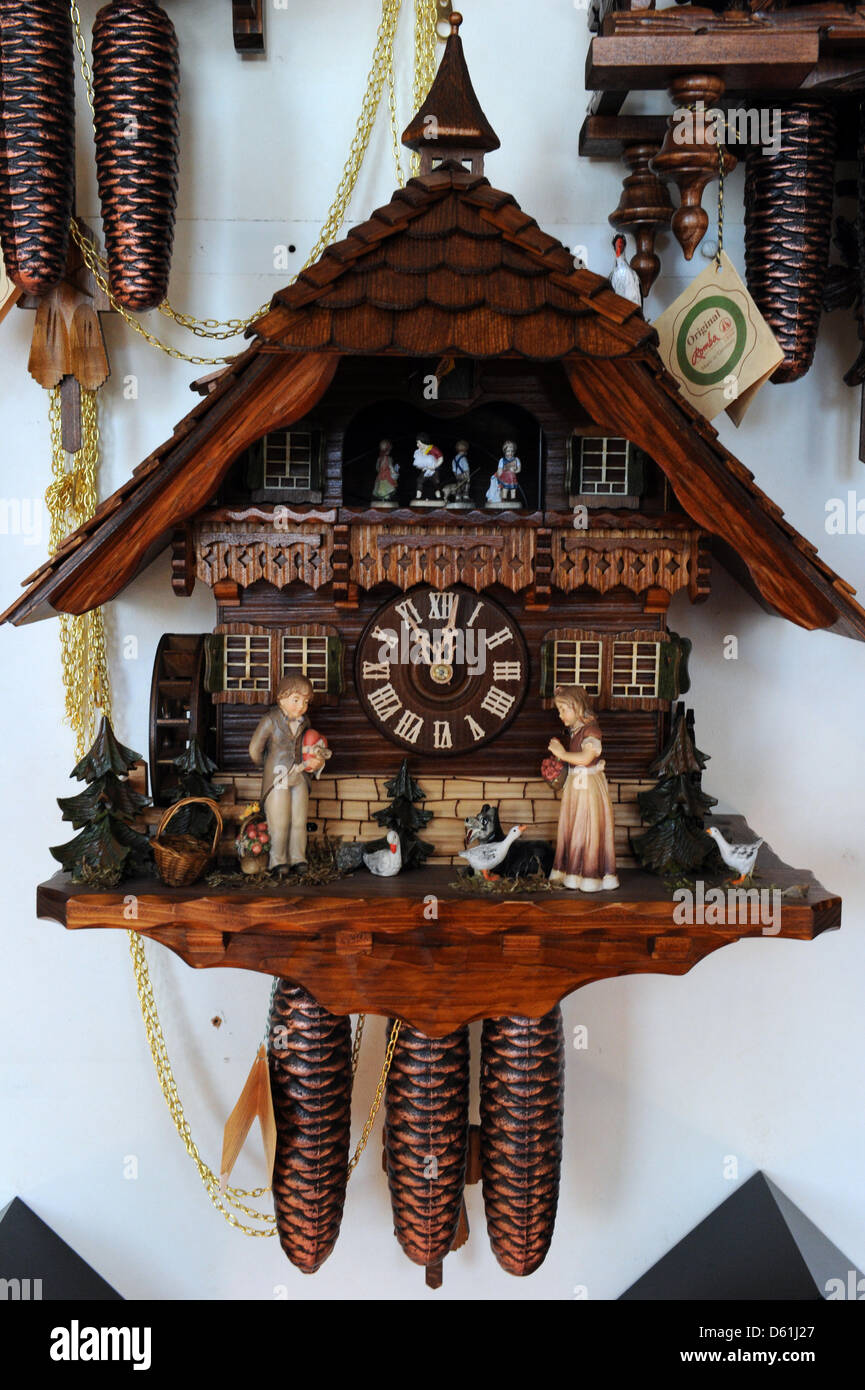 A cuckoo clock hangs on the wall in the clock manufacturer Rombach ...