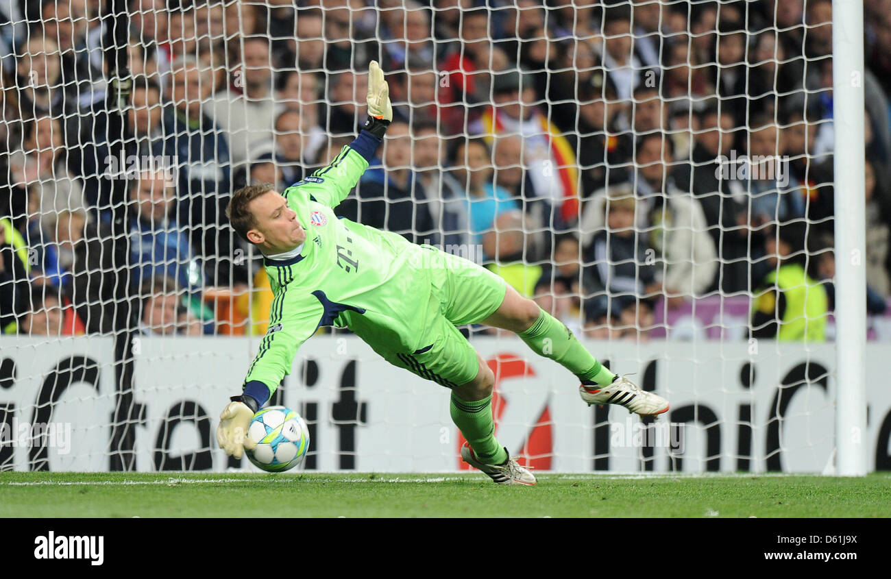 Munich's goalkeeper Manuel Neuer catches a ball during penalty shoot ...
