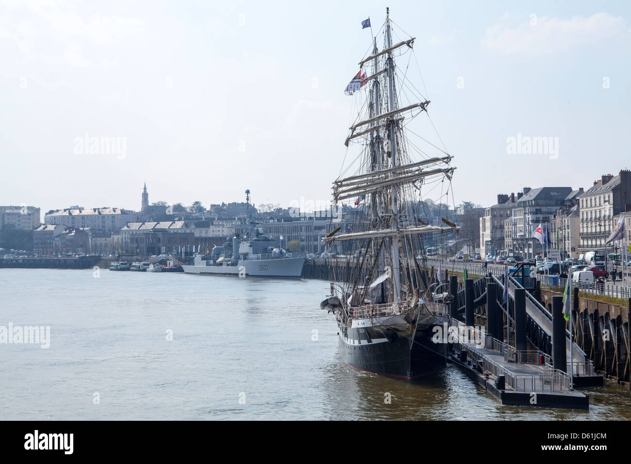The sailing ship Belem docked on the River Loire with the frigate ...