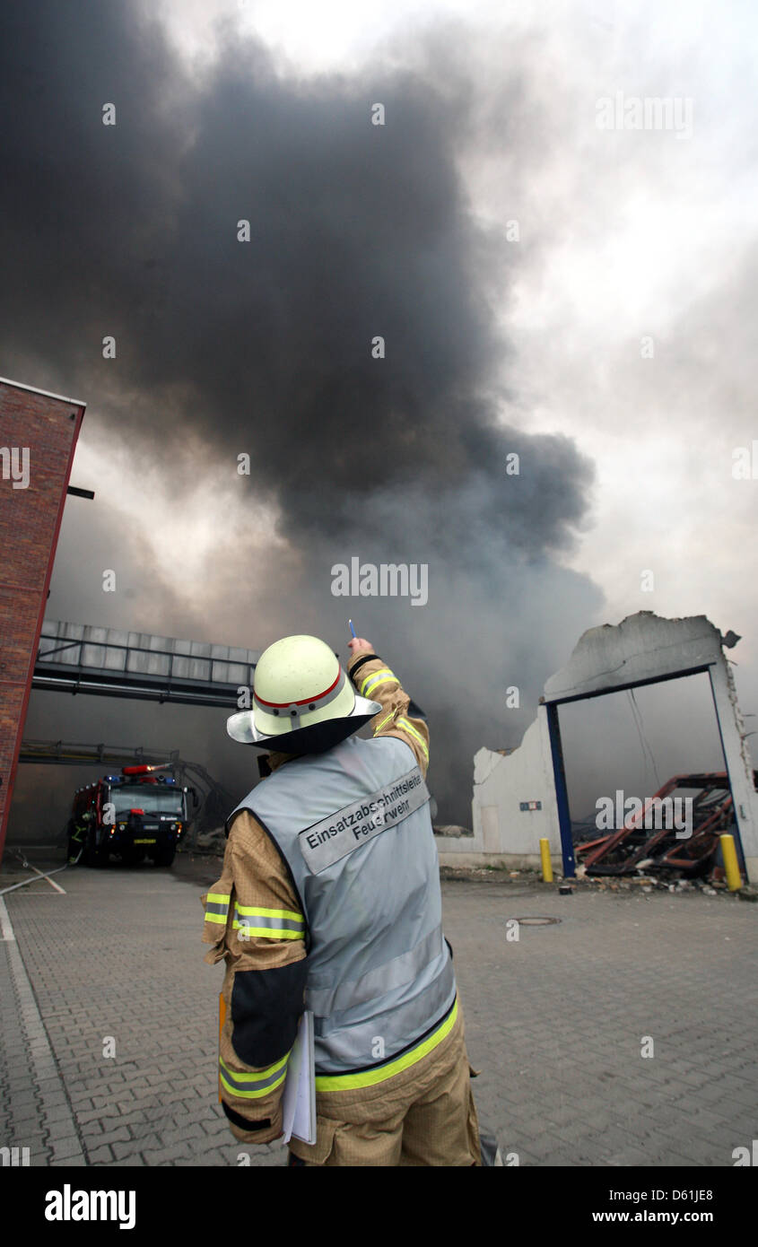 Firemen extingiush a fire in Berlin Siemensstadt, Germany, 26 April ...