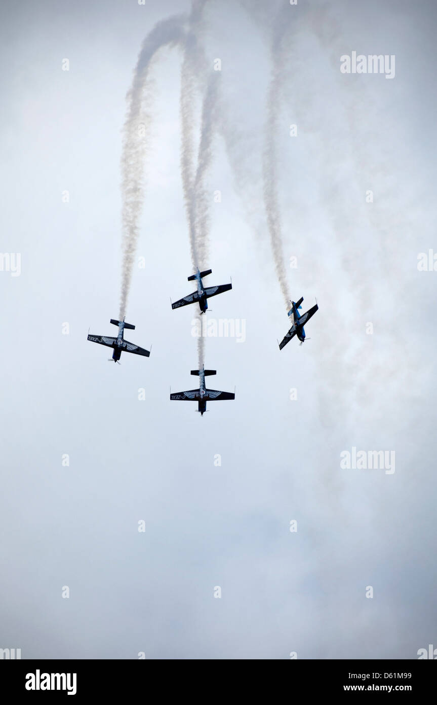 Vertical view of four aircraft in formation at an air display Stock ...