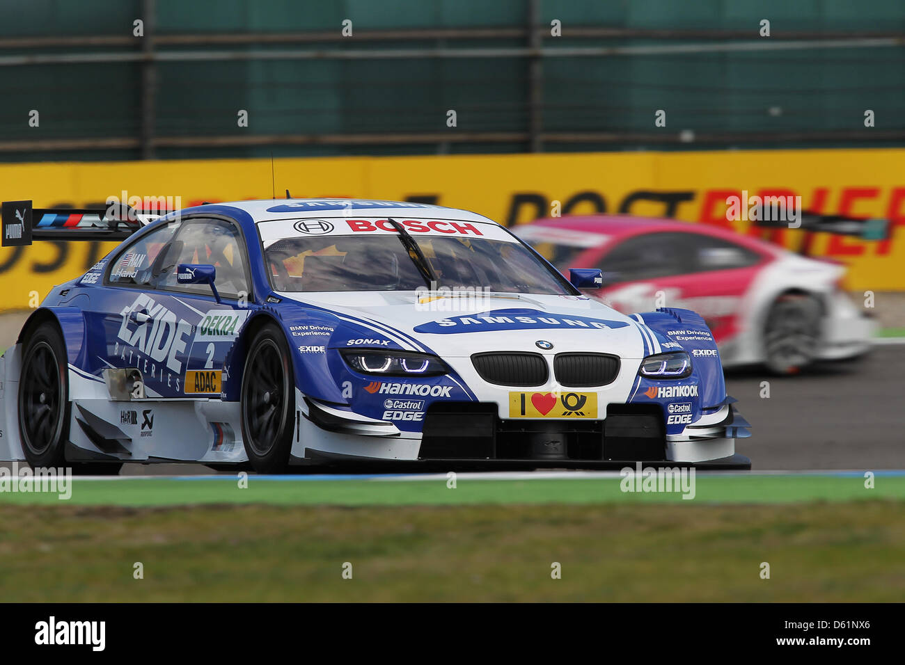 Race driver Joey Hand (front) from BMW Team RMG and Susie Wolff from ...