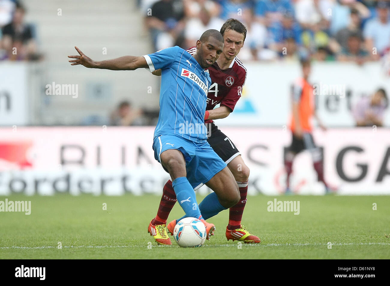 Hoffenheim's Ryan Babel (L) vies for the ball with Nuremberg's Markus ...