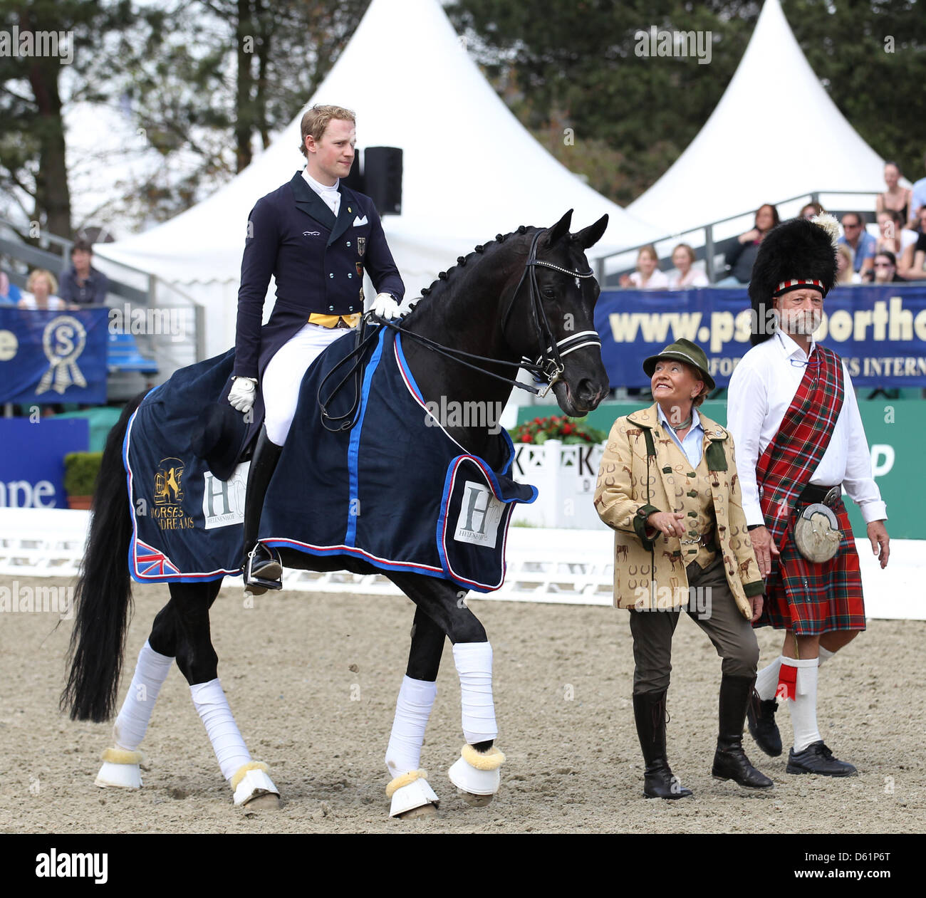 German equestrian Matthias Alexander Rath rides on his horse Totilas to ...