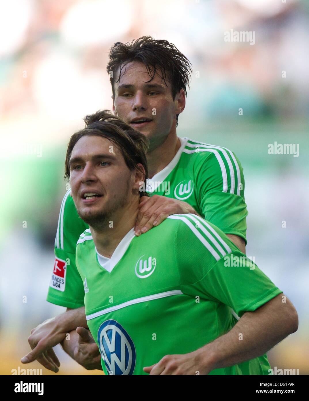 Wolfsburg's Patrick Helmes (front) celebrates his 3-1 goal with ...