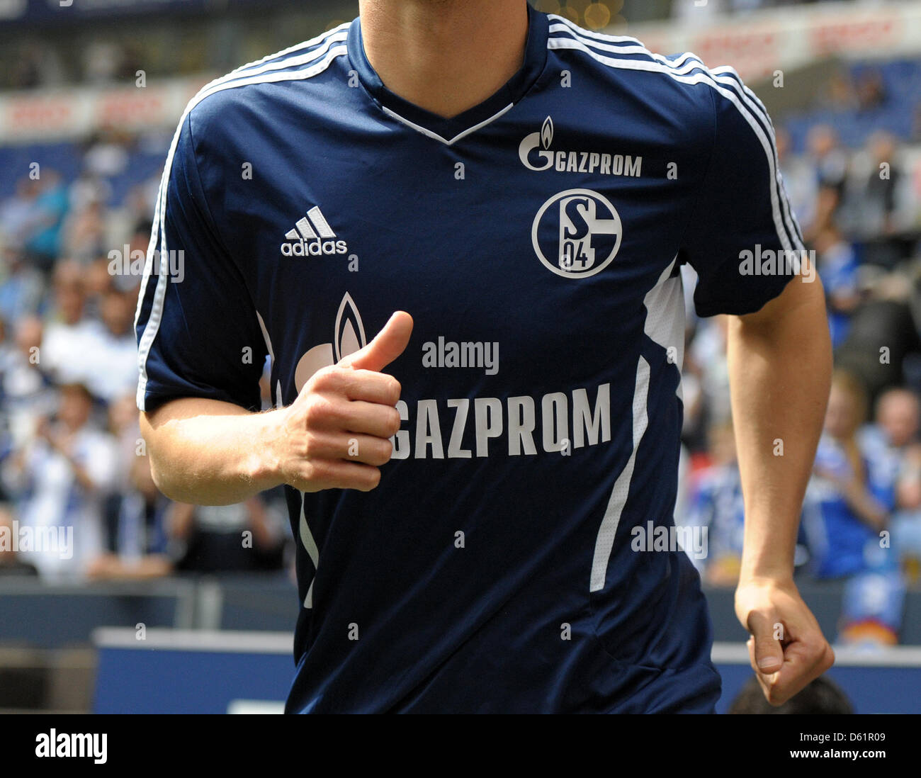 A Schalke team member wears the new shirt of the 2012/2013 season after ...