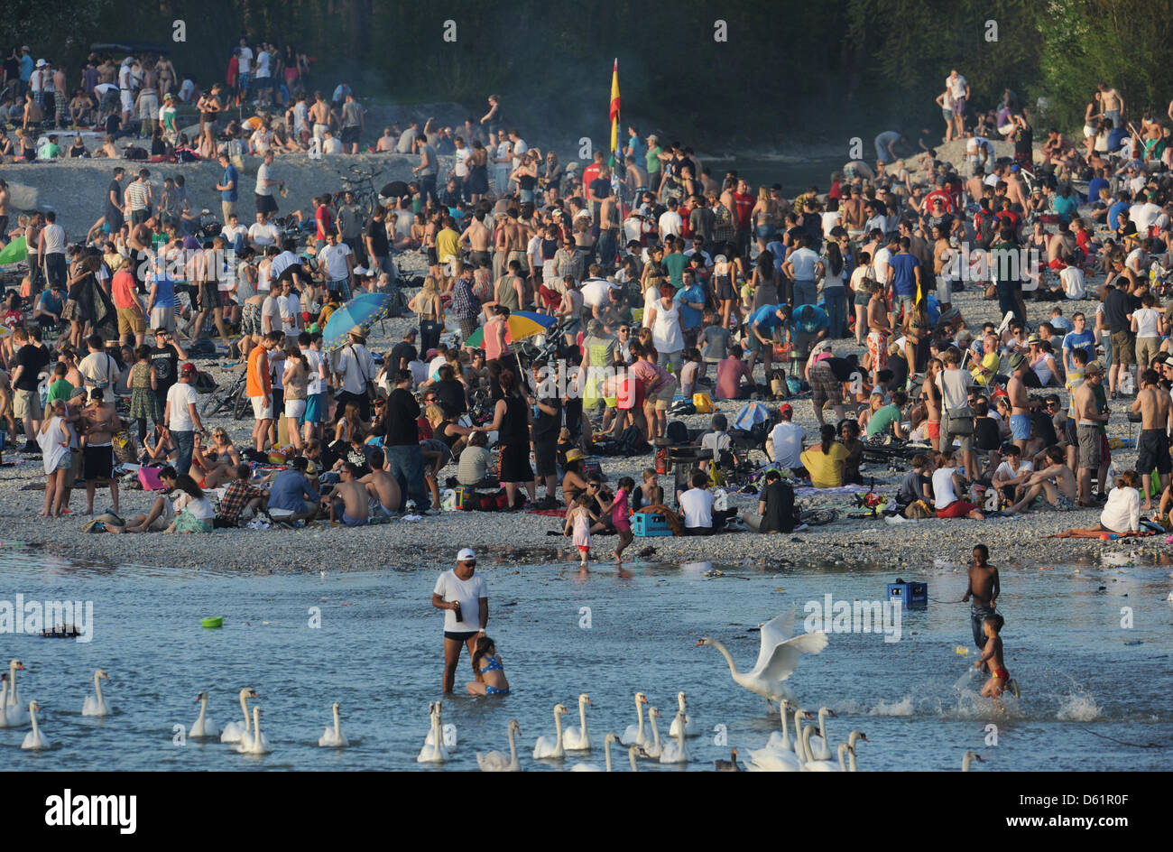 People relax at the beach of the Isar river in Munich, Germany, 28 ...
